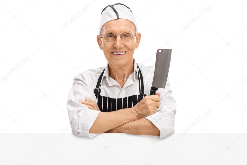 Butcher posing behind a panel Stock Photo by ©ljsphotography 123497706