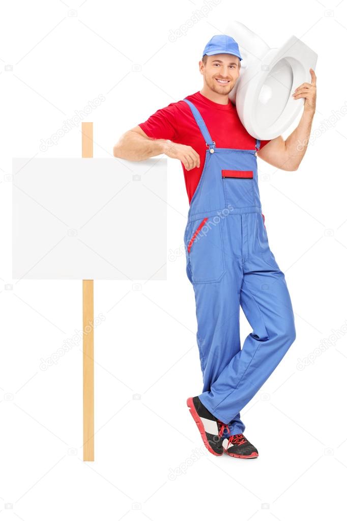 Male plumber standing by signboard — Stock Photo © ljsphotography #51960843