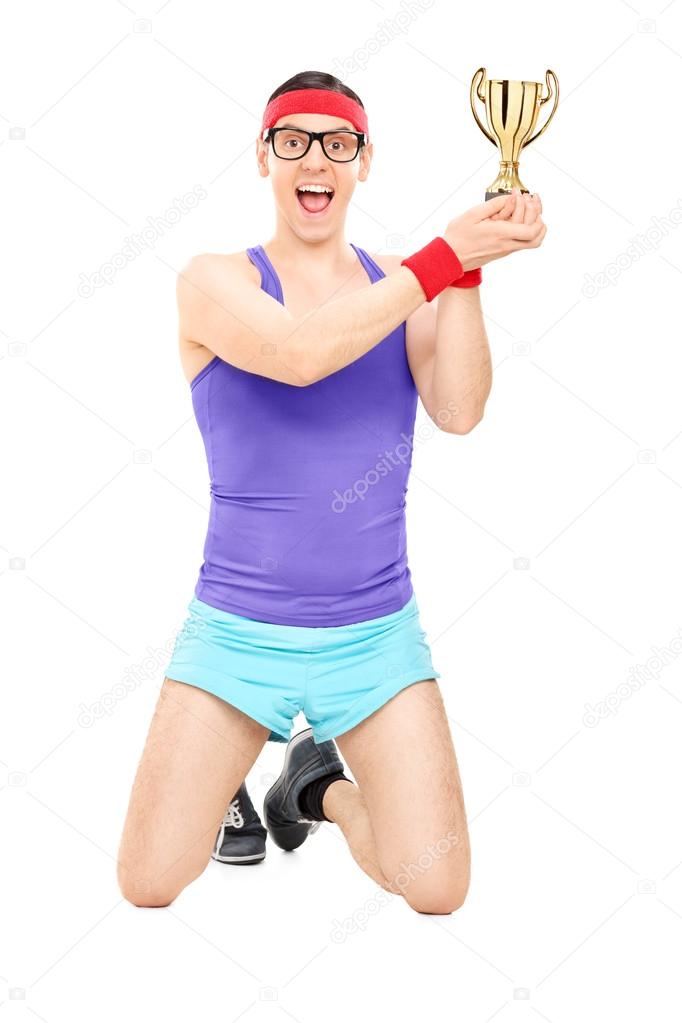 Male athlete celebrating trophy Stock Photo by ©ljsphotography 52648761