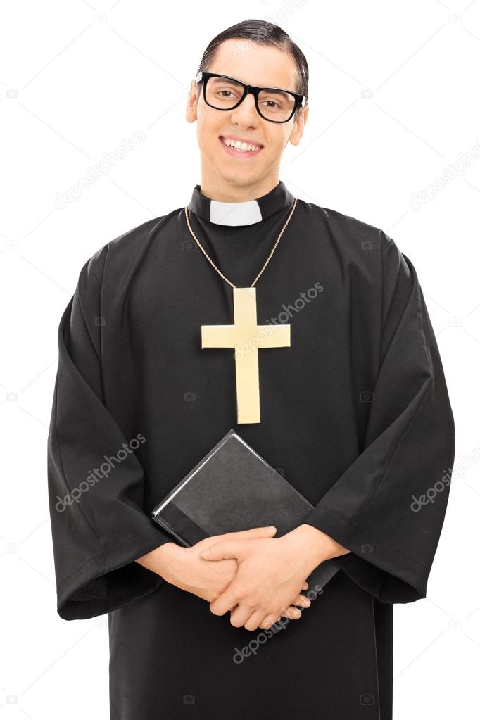 Priest holding the holy bible Stock Photo by ©ljsphotography 80686376