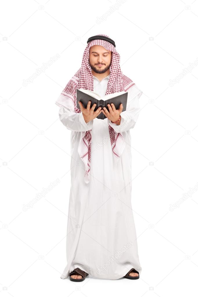 Arab in a white robe reading a book Stock Photo by ©ljsphotography 88773236