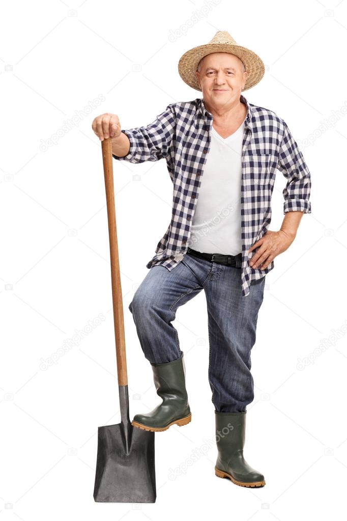Mature farmer posing with a shovel Stock Photo by ©ljsphotography 93707908