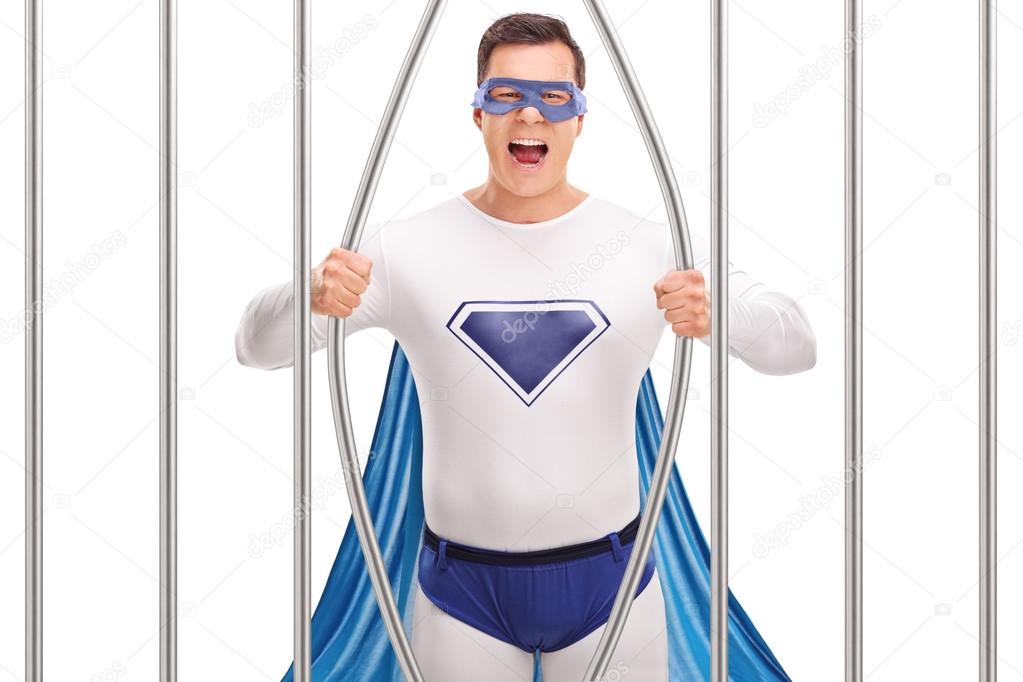 Young superhero breaking out of prison Stock Photo by ©ljsphotography ...