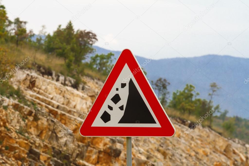 Warning stone fall road sign on mountain road Stock Photo by ©Tartalia 65404303