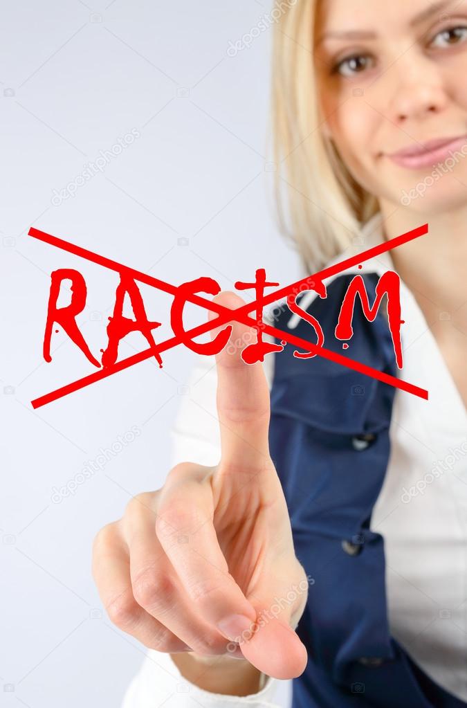 Woman presses a finger on a word crossed out racism — Stock Photo ...