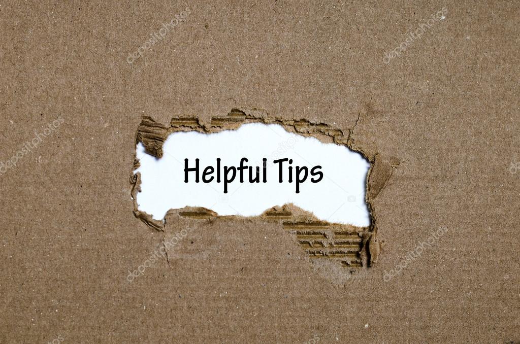 The word helpful tips appearing behind torn paper — Stock Photo ...