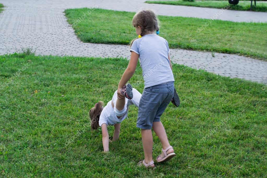 Children playing on the grass Stock Photo by ©rm211171 112975902