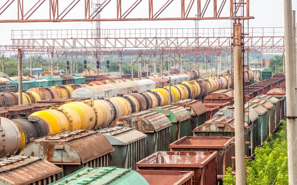 Many trains with cargo wagons Stock Photo by ©ChechotkinAnton 108929814