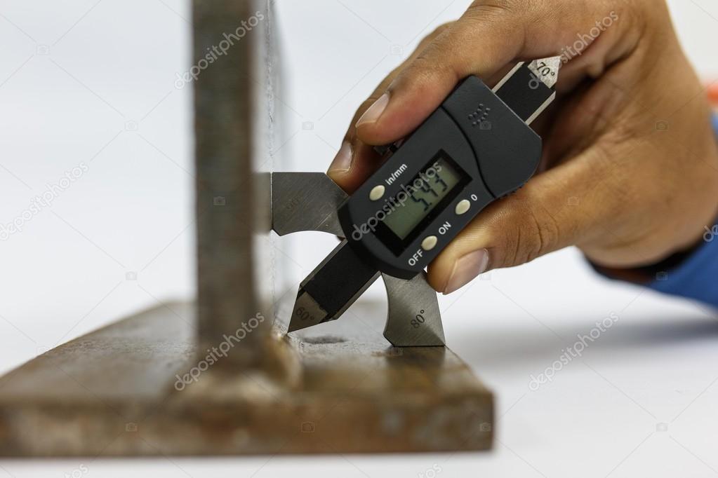 Inspection weldment by welding gage Stock Photo by ©kimtaro 91842192