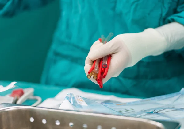 Scrub nurse prepare medical instruments for surgery — Stock Photo ...