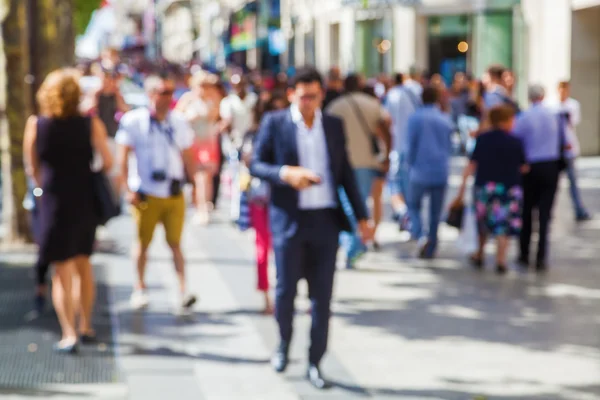 Crowd of people out of focus on a strolling promenade — Stock Photo ...