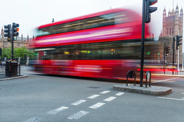 Red London Bus in motion blur in London, England - Stock Image - Everypixel