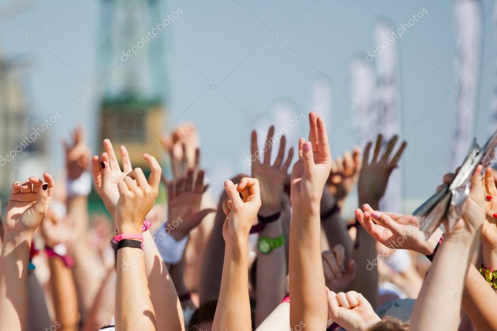 Raised hands of a crowd of people at a sport event — Stock Photo ...