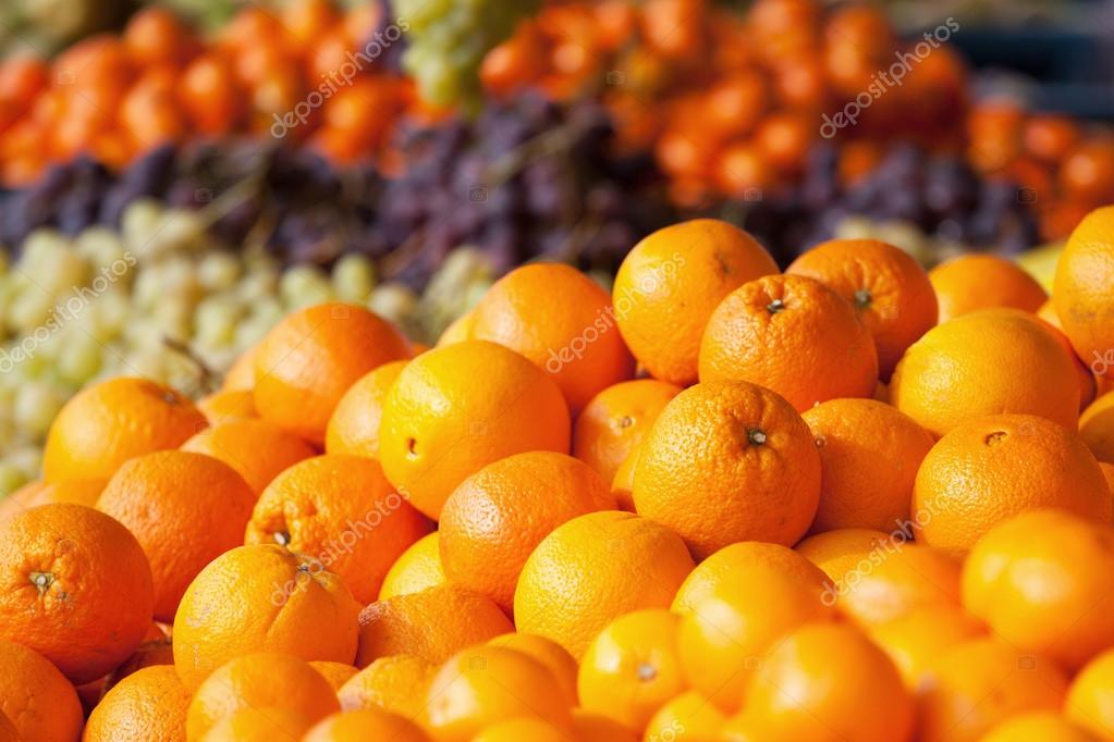 Bulk of oranges at a market stall Stock Photo by ©Madrabothair 54758113
