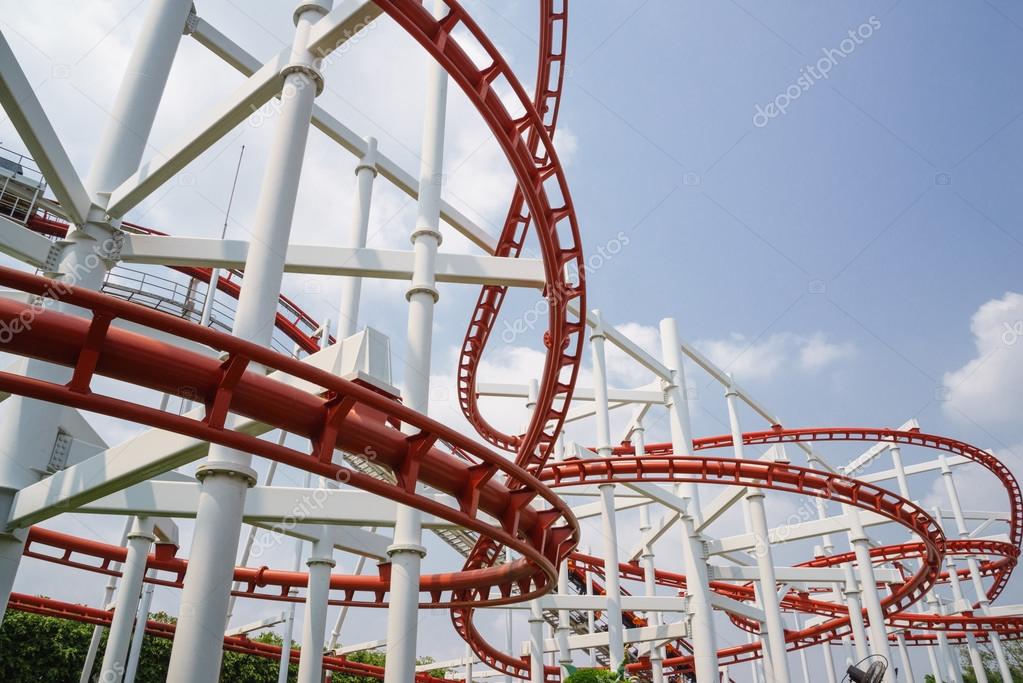 Red roller coasters in amusement park or theme park look fun and ...
