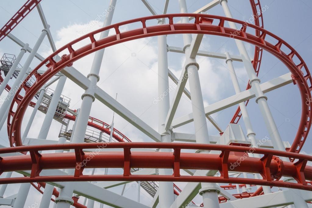 Red roller coasters in amusement park or theme park look fun and ...