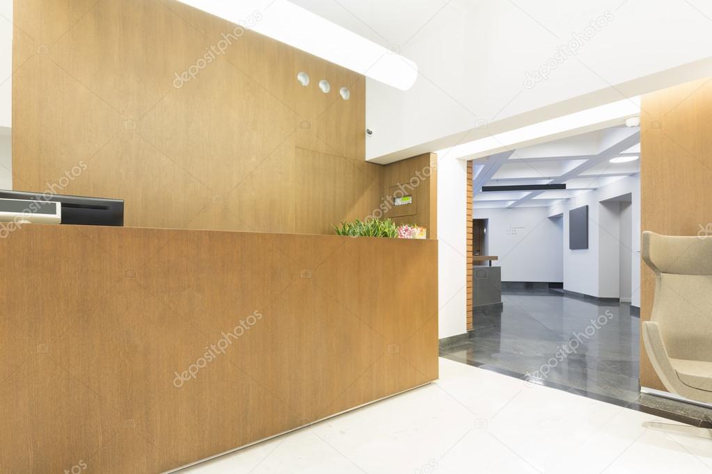 Reception area with wooden reception table — Stock Photo © rilueda ...