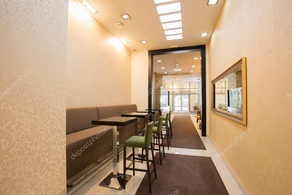 Hotel corridor with bar stools and tables — Stock Photo © rilueda ...