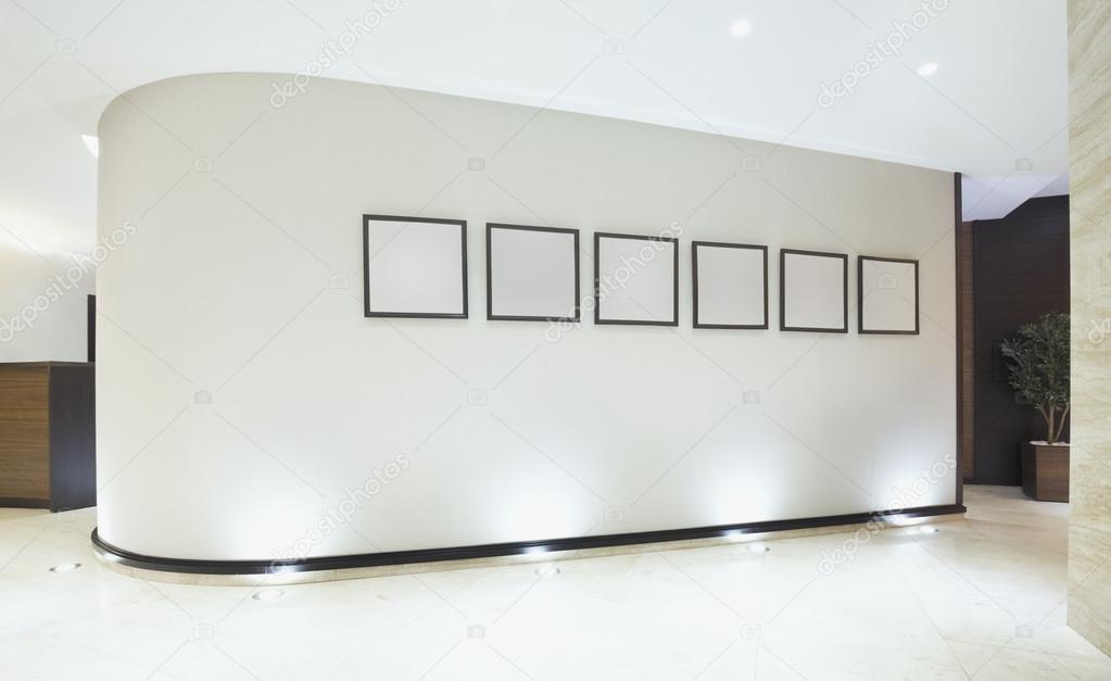 Empty picture frames in luxury building corridor — Stock Photo ...