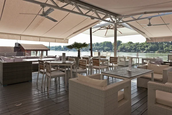 Modern riverside cafe terrace — Stock Photo © rilueda #64831683