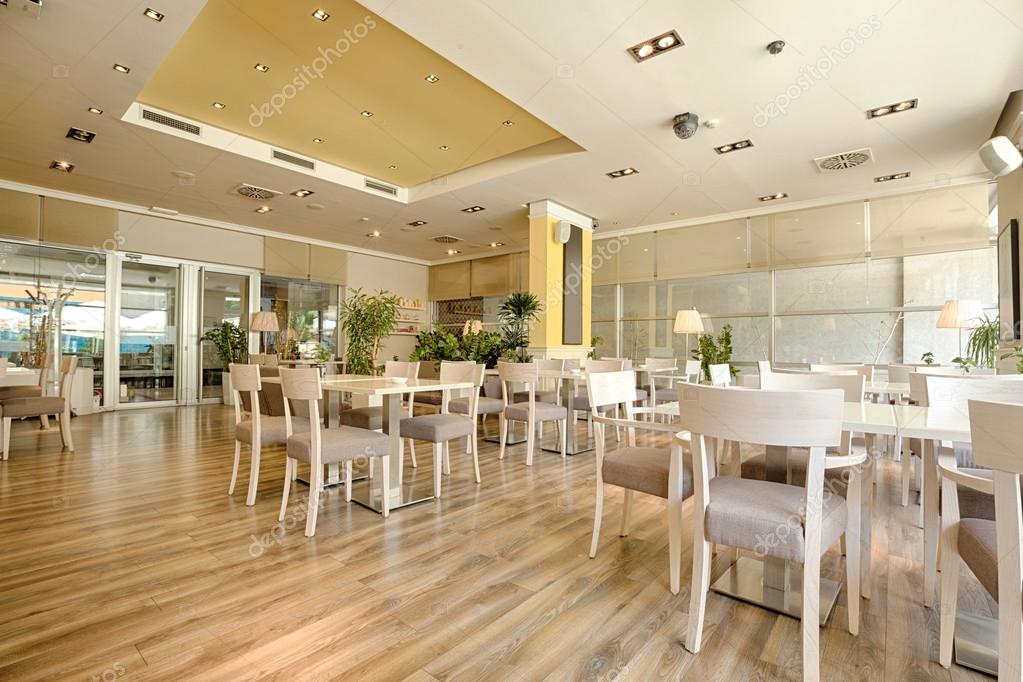 Interior of a beautiful bright cafe Stock Photo by ©rilueda 82919128