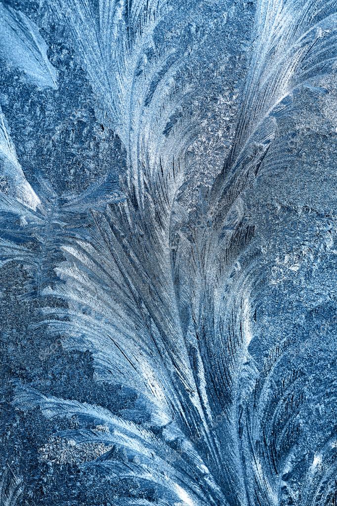 Ice patterns on winter glass Stock Photo by ©matehavitaliy 102267950
