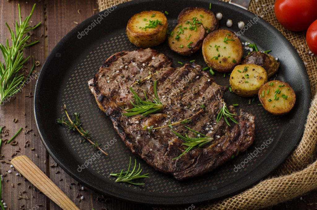 Beef rib eye steak — Stock Photo © Peteer #77314064