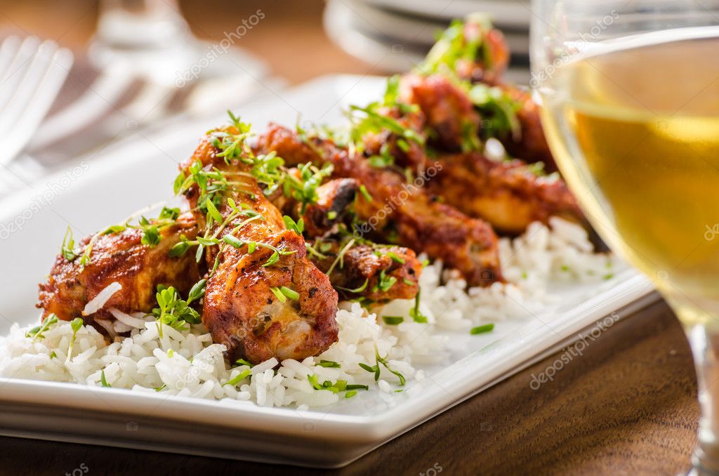 Hot wings with basmati rice Stock Photo by ©Peteer 97399366