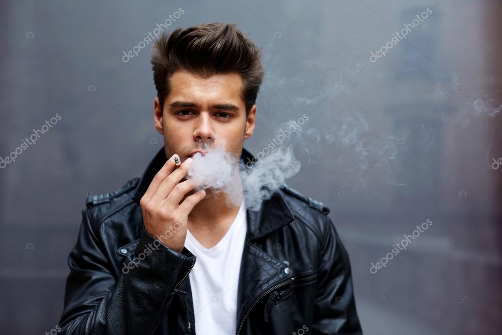 Man exhaling cigarette smoke Stock Photo by ©GaudiLab 69203031