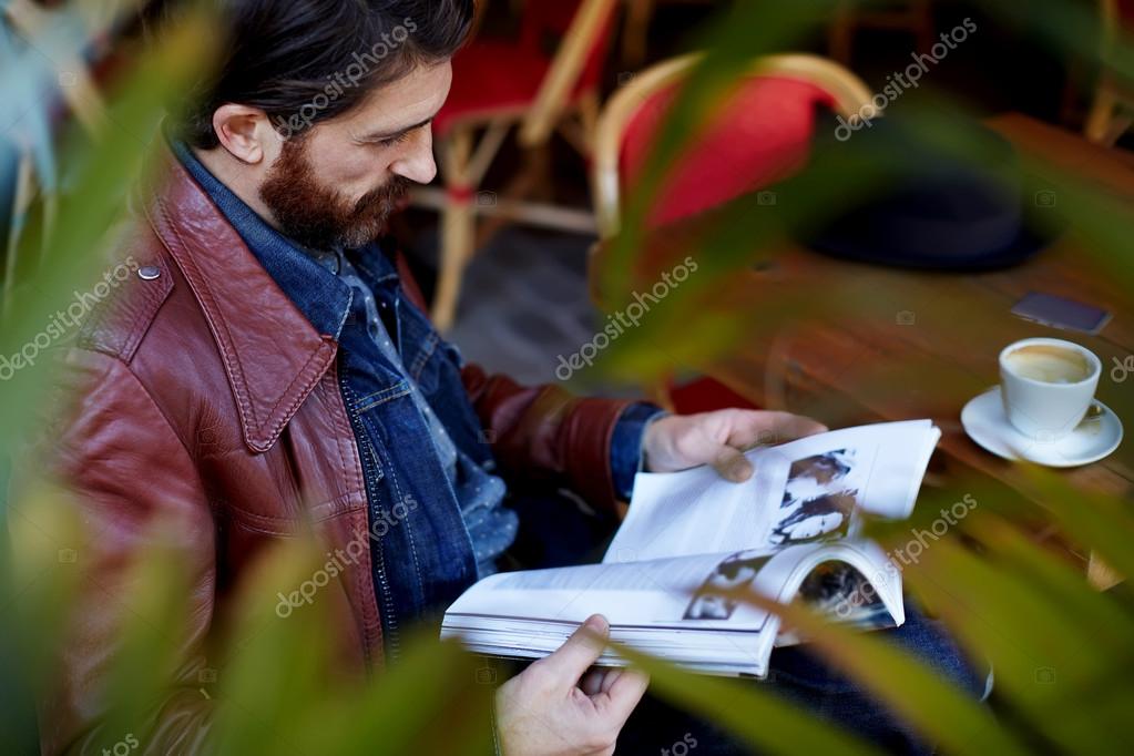 Person Reading A Magazine