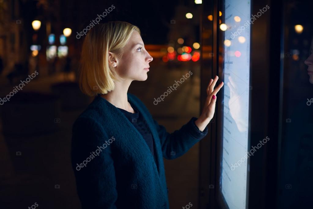 Woman using touch sensitive display on street — Stock Photo © GaudiLab ...