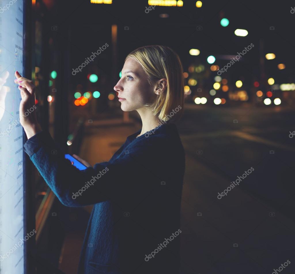 Woman using touch sensitive display on street — Stock Photo © GaudiLab ...