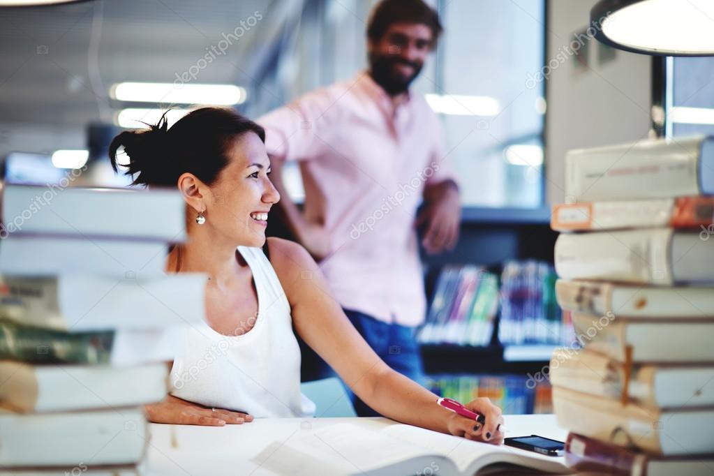 Students in library having fun — Stock Photo © GaudiLab #73330797
