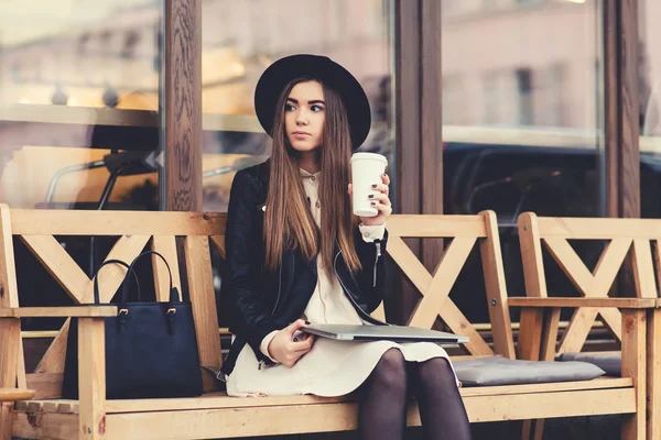Trendy woman resting after work on net-book - Stock Image - Everypixel