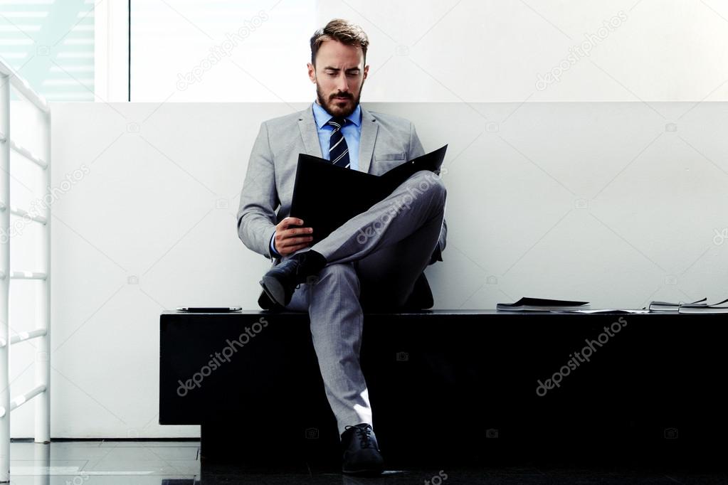Confident man reading paper documents — Stock Photo © GaudiLab #89749098