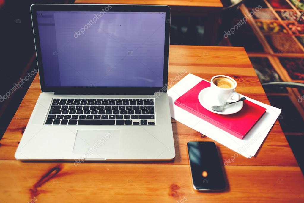 Laptop computer with cell telephone on table Stock Photo by ©GaudiLab ...