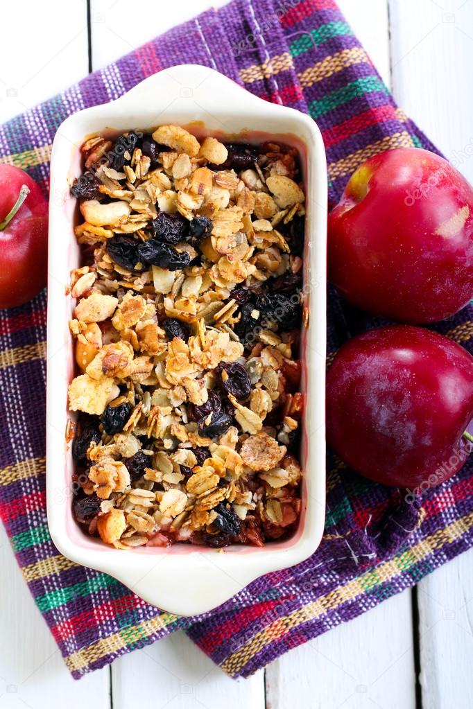 Plum crumble with oat and raisin topping — Stock Photo © manyakotic ...
