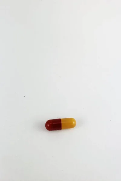 Red yellow capsule pill Stock Photos, Royalty Free Red yellow capsule ...