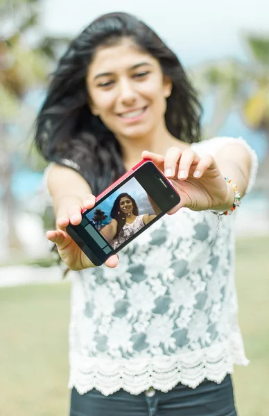 Woman shooting its own photo - Stock Image - Everypixel
