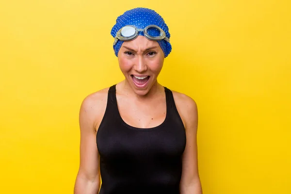 Young Australian Swimmer Woman Isolated Yellow Background Raising Fist ...