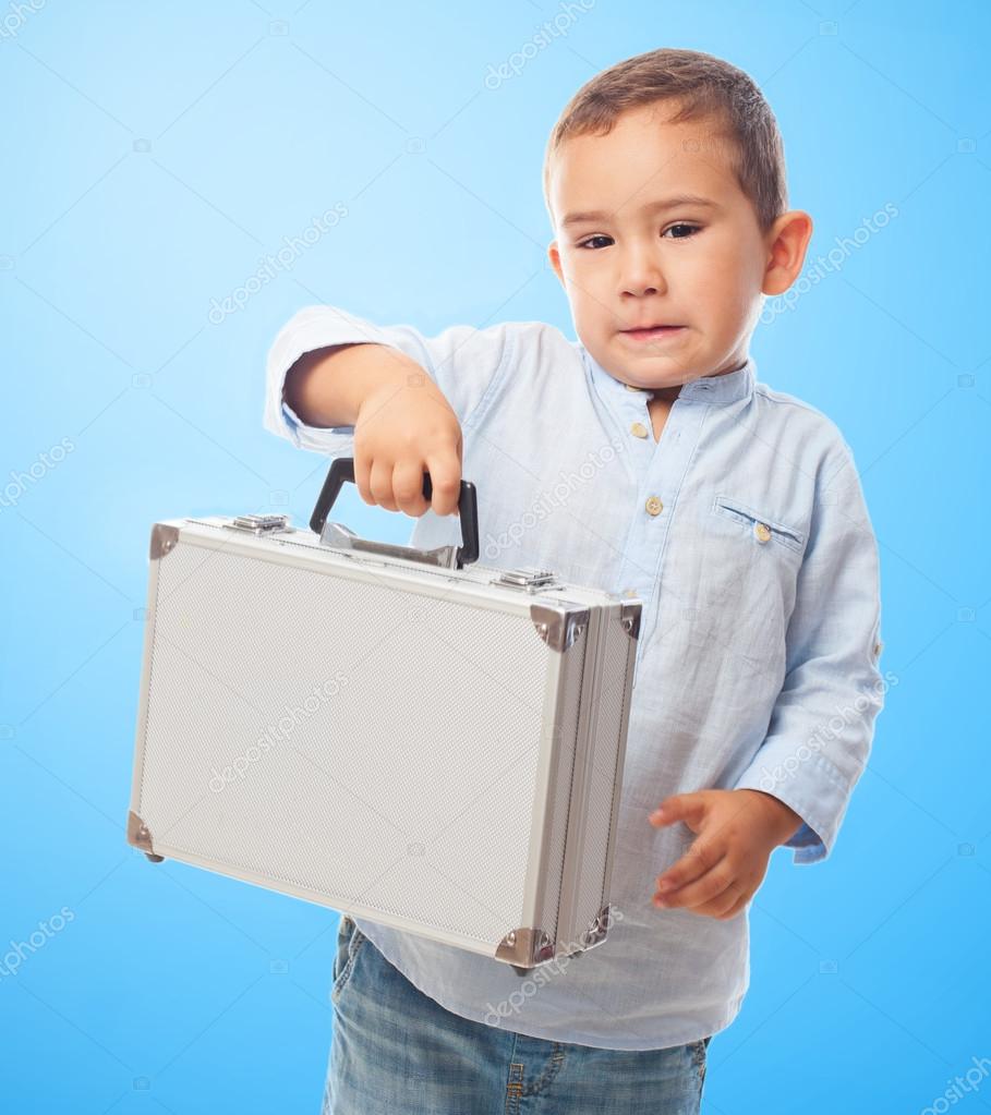 Little boy holding briefcase Stock Photo by ©AsierRomeroCarballo 62759125