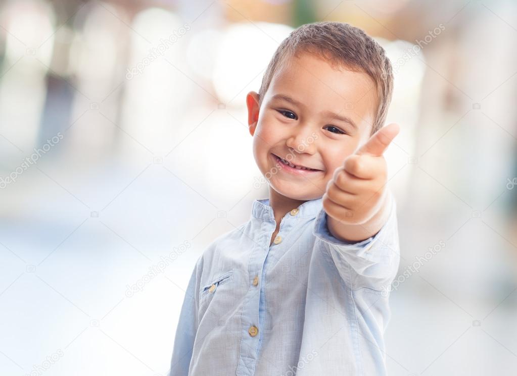 Little boy doing okay gesture Stock Photo by ©AsierRomeroCarballo 62759321