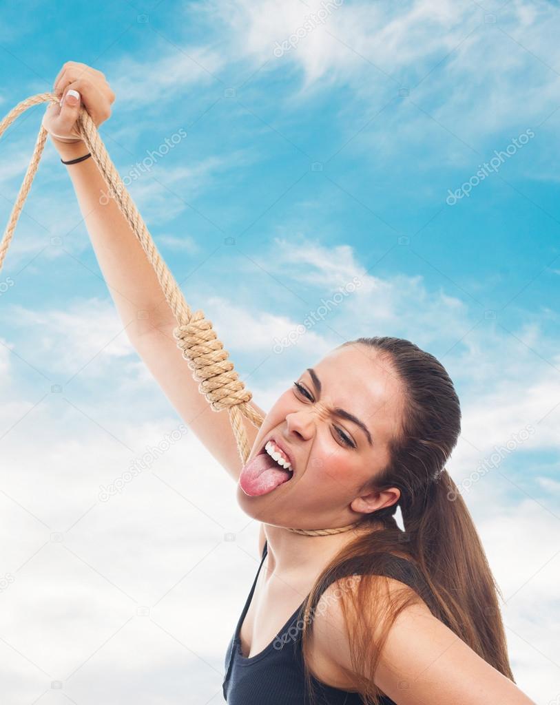 Woman hanging with a rope — Stock Photo © AsierRomeroCarballo #66613581