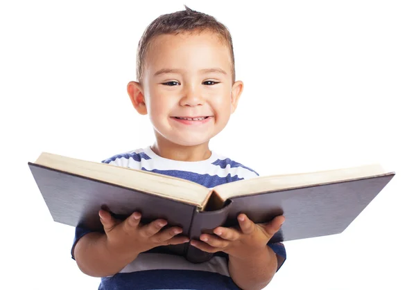 Kid holding book — Stock Photo © AsierRomeroCarballo #67004539