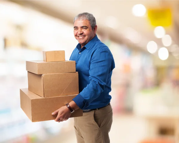 Man holding boxes Stock Photo by ©AsierRomeroCarballo 69995981