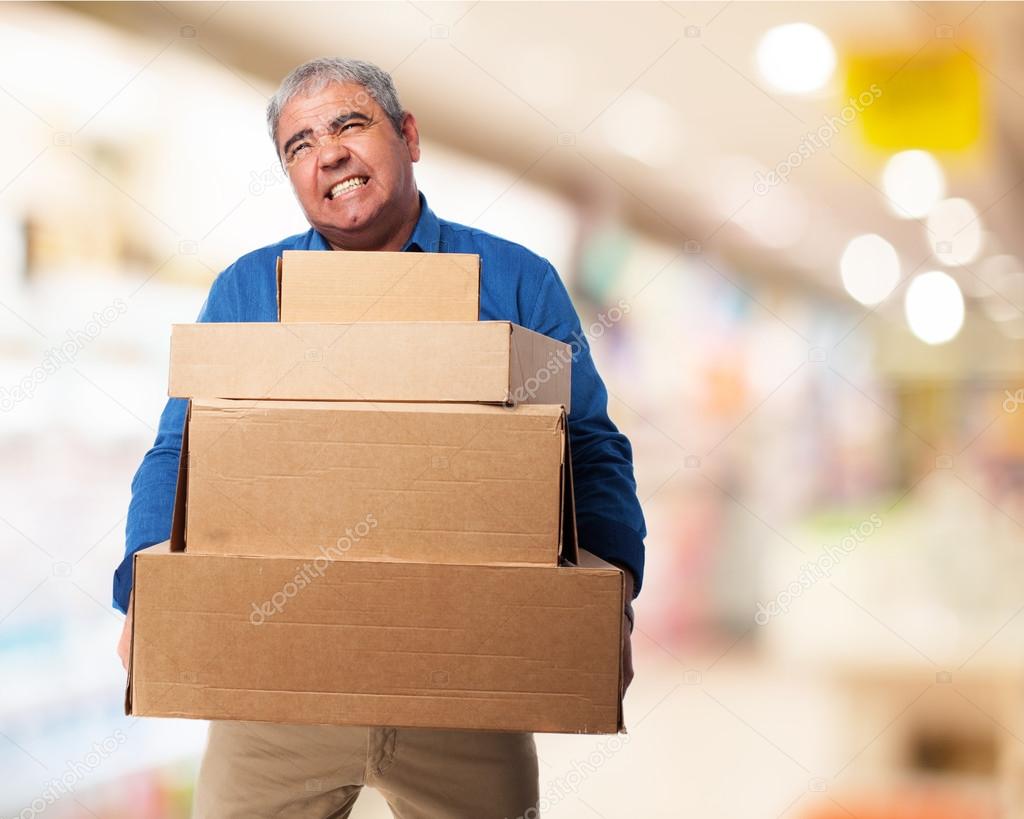 Man holding boxes Stock Photo by ©AsierRomeroCarballo 69995981
