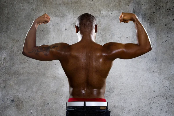 Man flexing back muscles - Stock Image - Everypixel