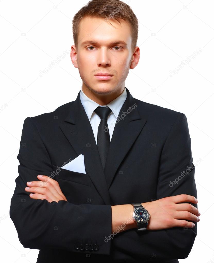 Portrait of a successful young business man standing isolated on grey ...