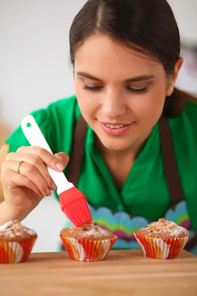Woman is making cakes in the kitchen - Stock Image - Everypixel