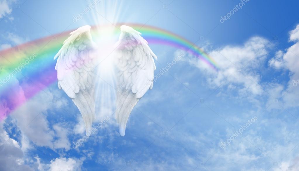 Angel Wings and rainbow on blue sky background — Stock Photo ...